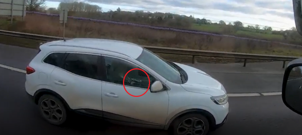 Police in unmarked HGV catch driver steering transporter with his elbow ...